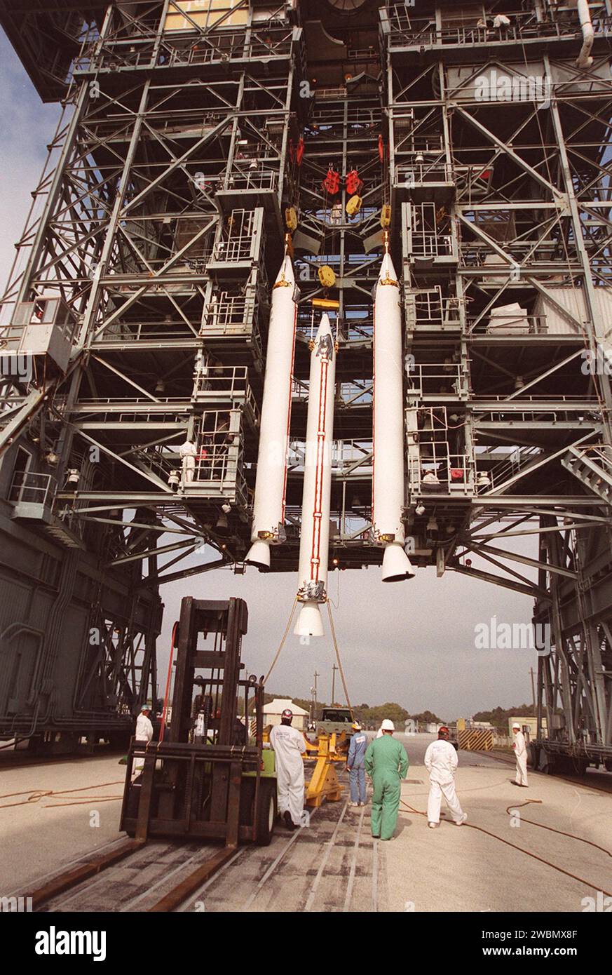 Workers on Launch Pad 17-A, Cape Canaveral Air Force Station, watch as ...
