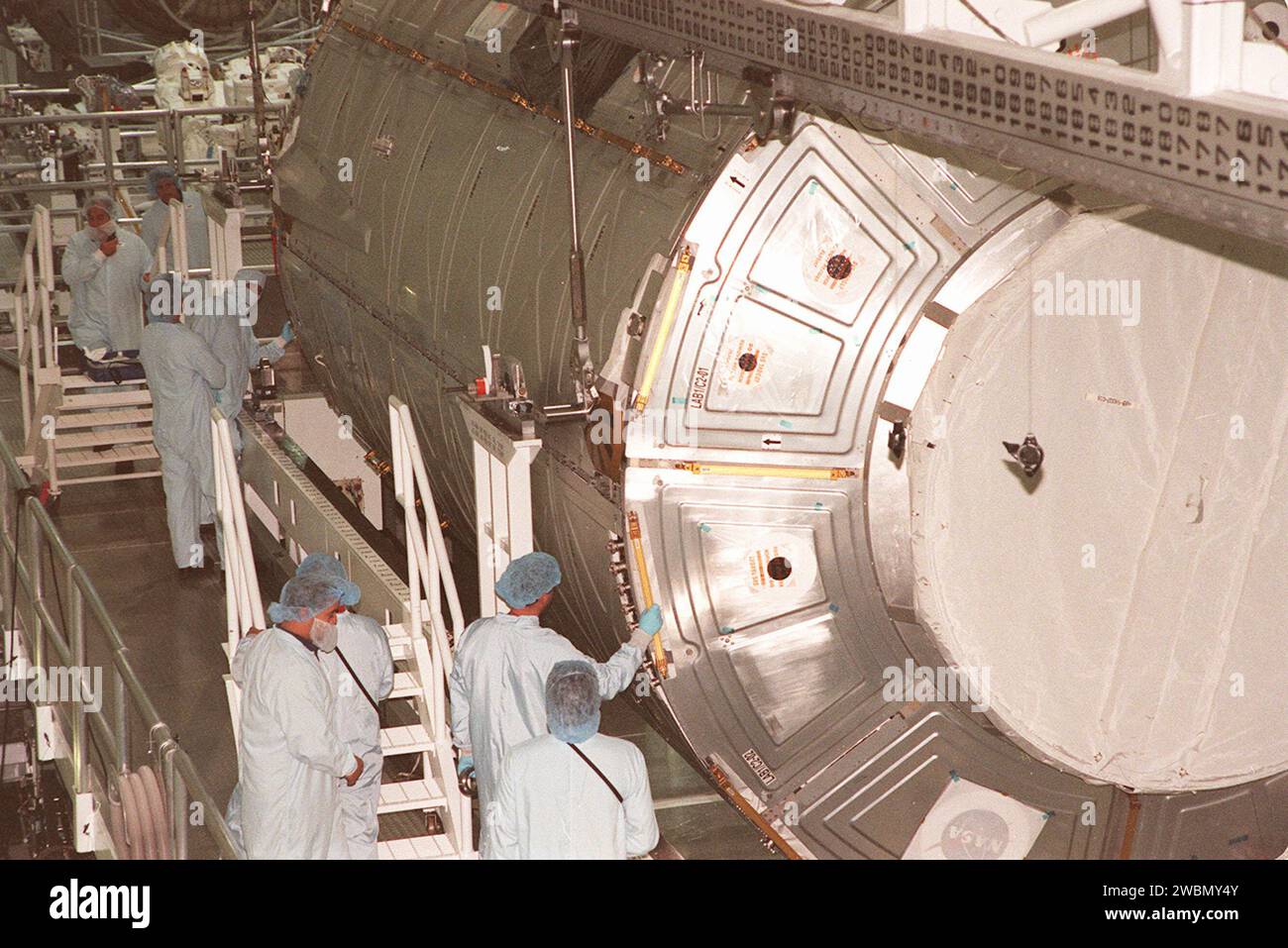 KENNEDY SPACE CENTER, FLA. -- Workers in the Space Station Processing ...