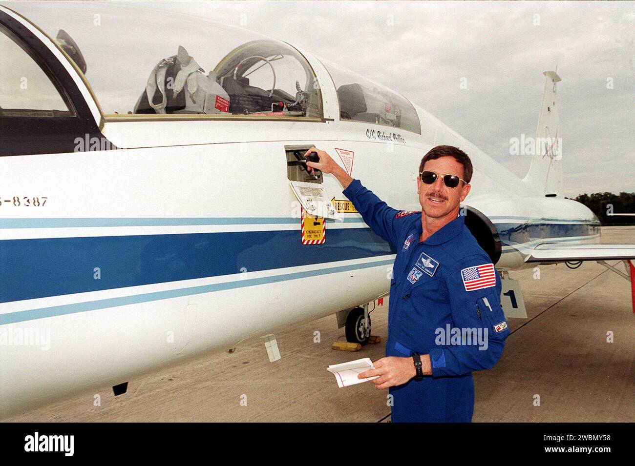 KENNEDY SPACE CENTER, Fla. -- STS-105 Commander Scott Horowitz checks ...