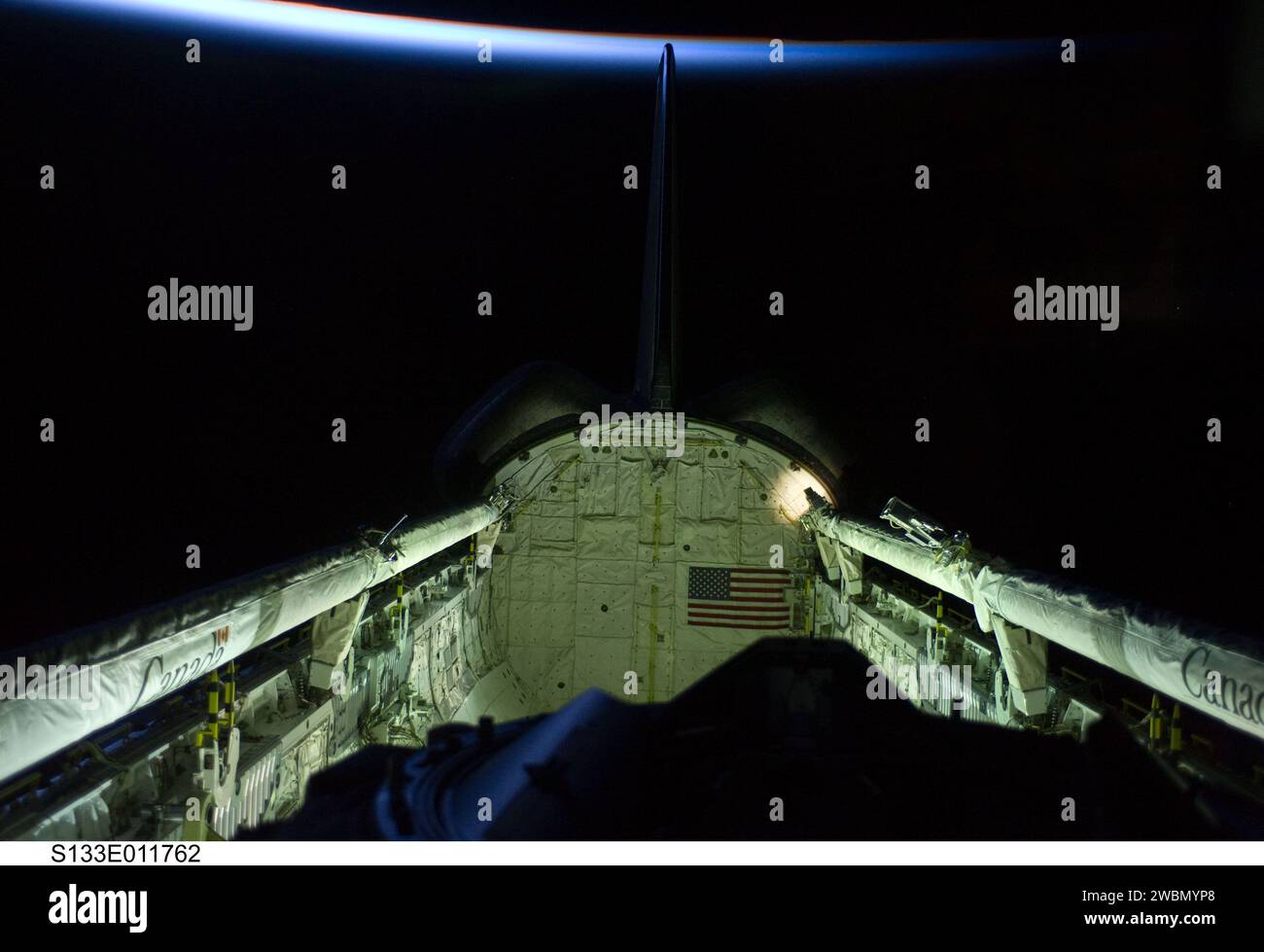 S133-E-011762 (7 March 2011) --- Space shuttle Discovery’s vertical ...