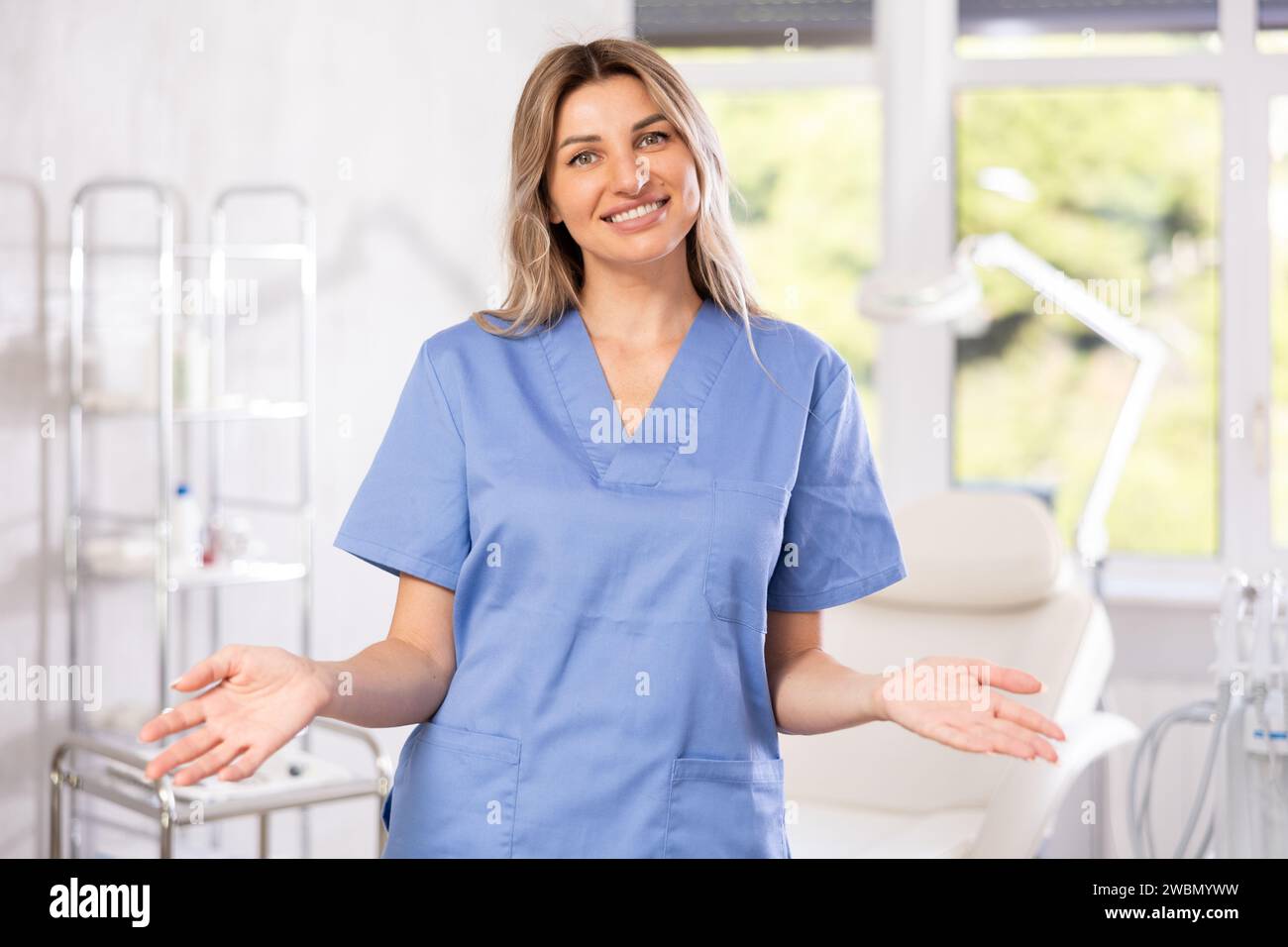 Portrait of female health worker meeting patient in medical office ...