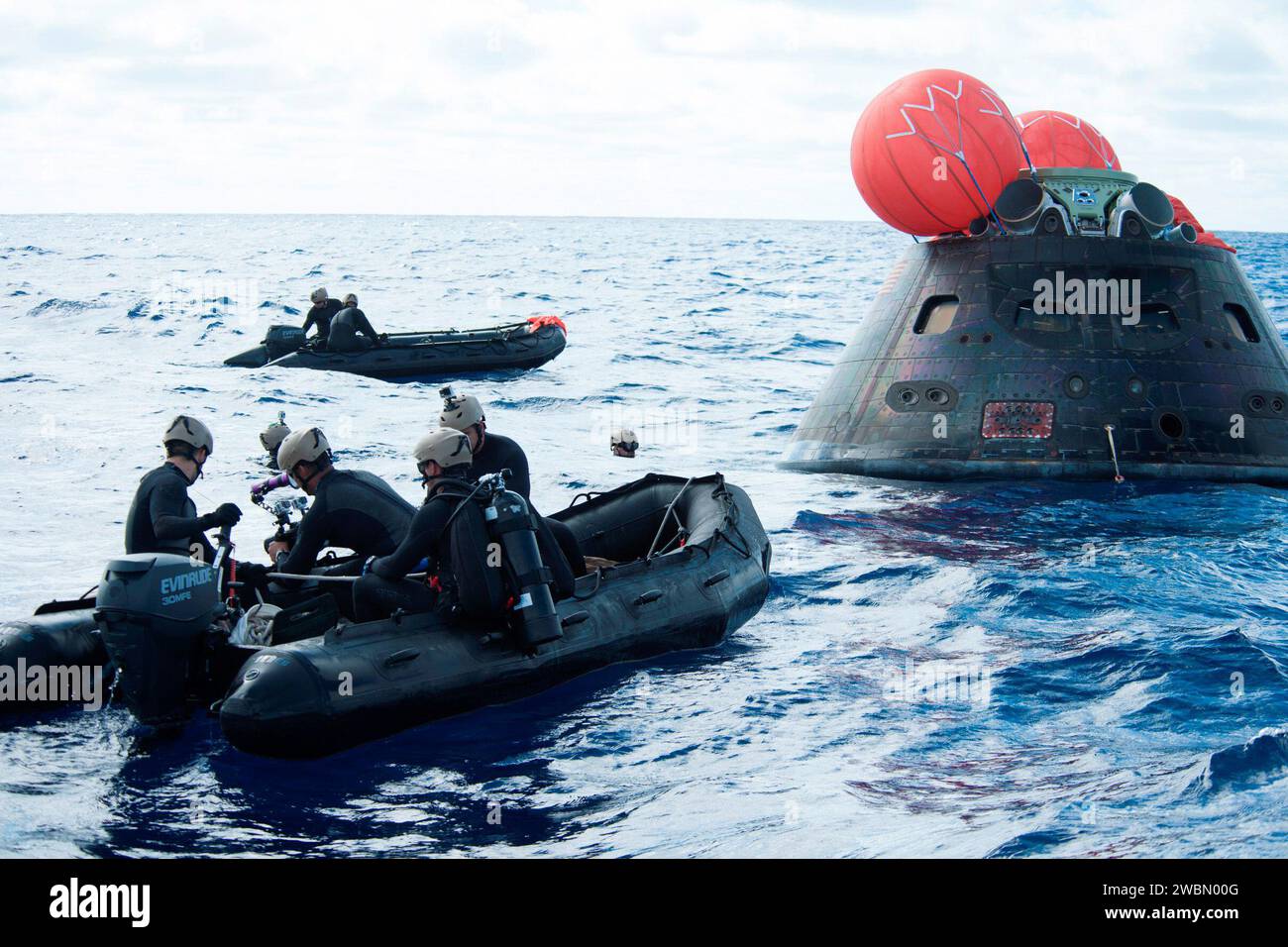 Recovery team members in rigid-hulled inflatable boats approach NASA's ...