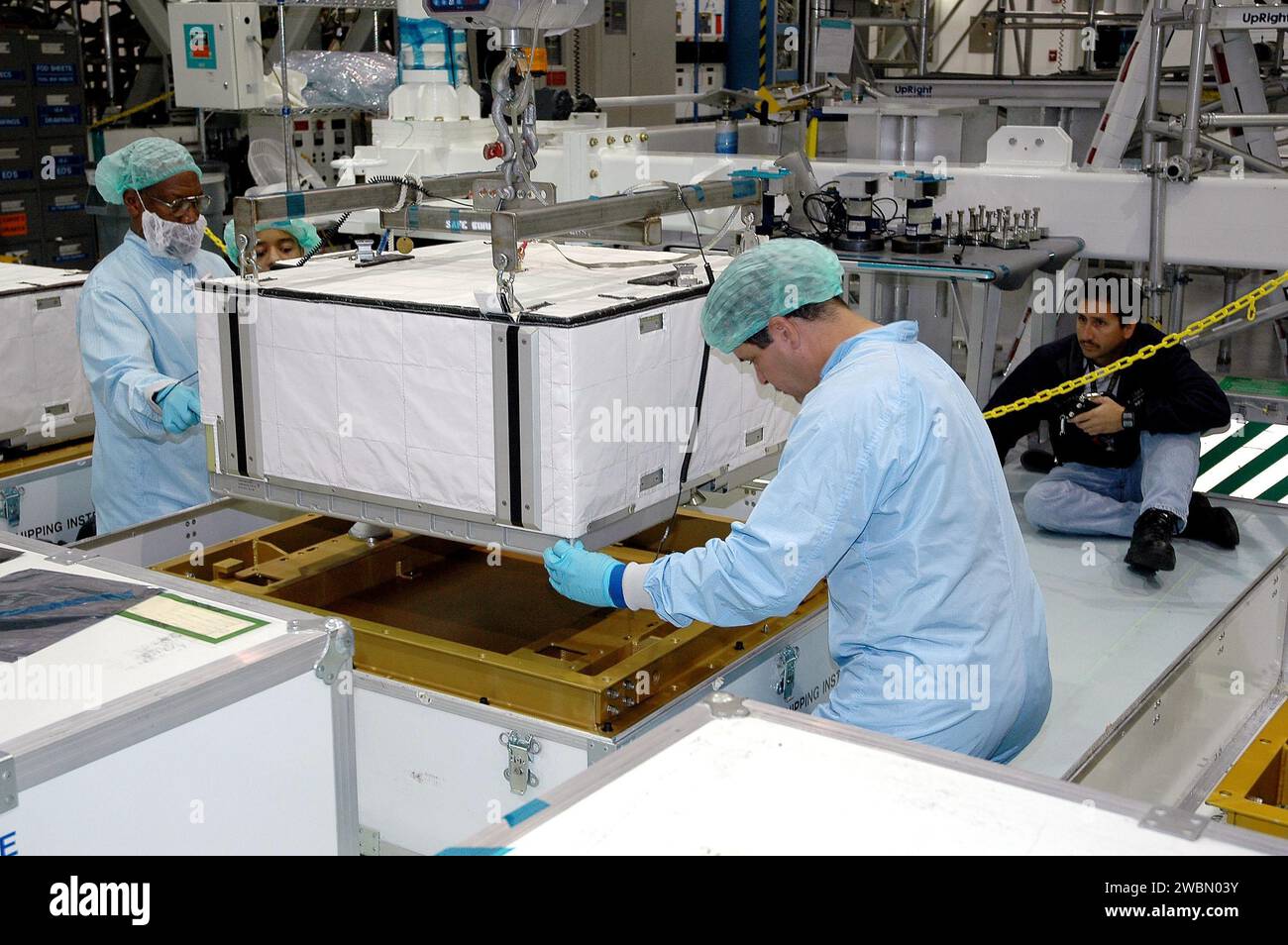 KENNEDY SPACE CENTER, FLA. - Technicians in the Space Station ...
