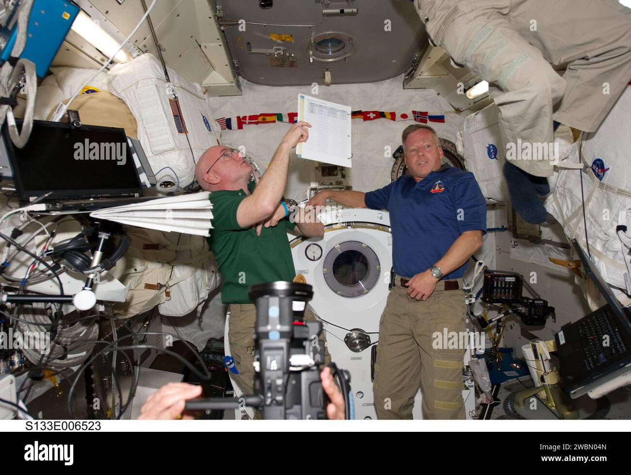 S133-E-006523 (26 Feb. 2011) --- NASA astronauts Scott Kelly (left ...