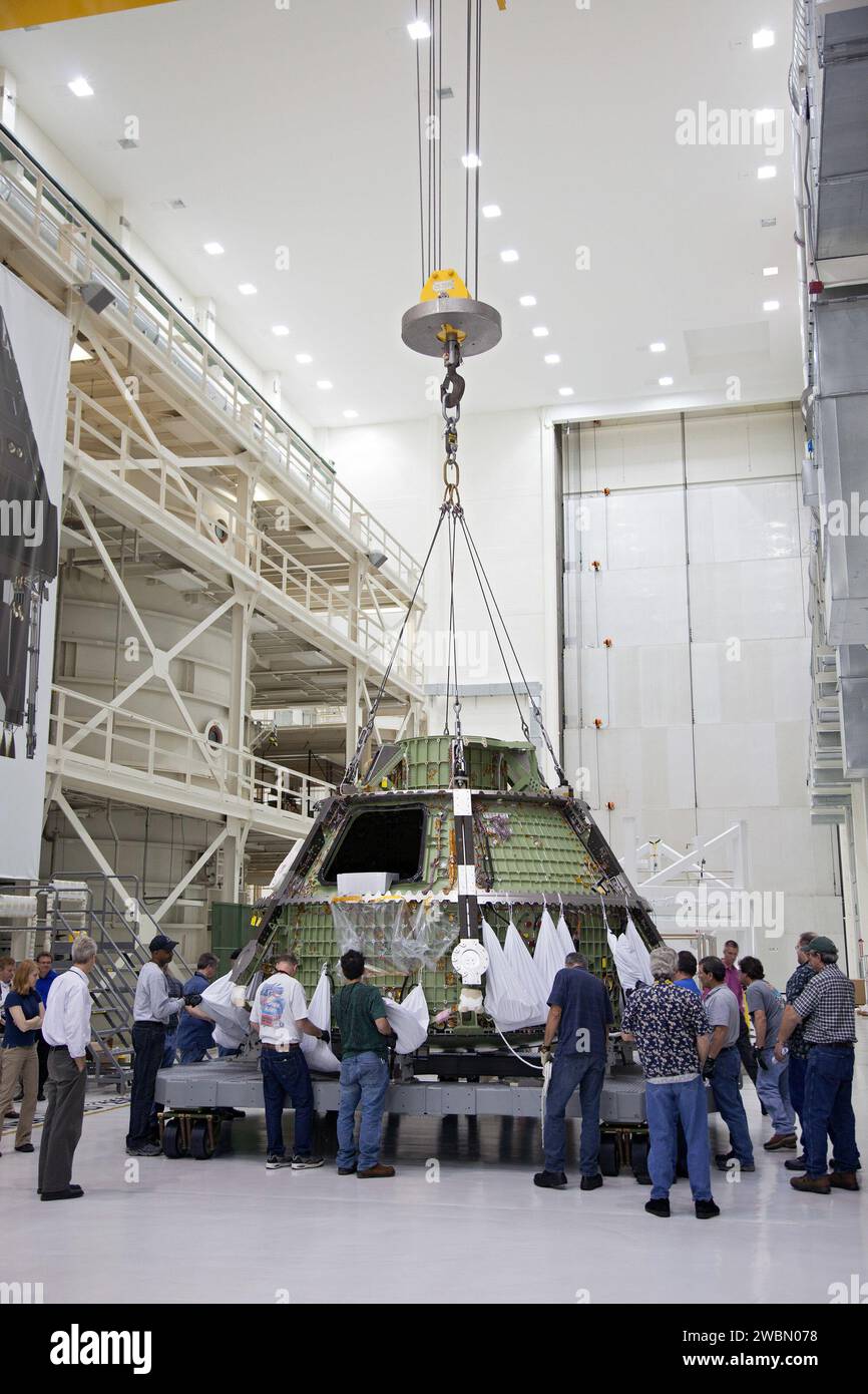 Technicians move the Exploration Flight Test-1 (EFT-1) Orion crew ... Technicians move the Exploration Flight Test-1 (EFT-1) Orion crew ...