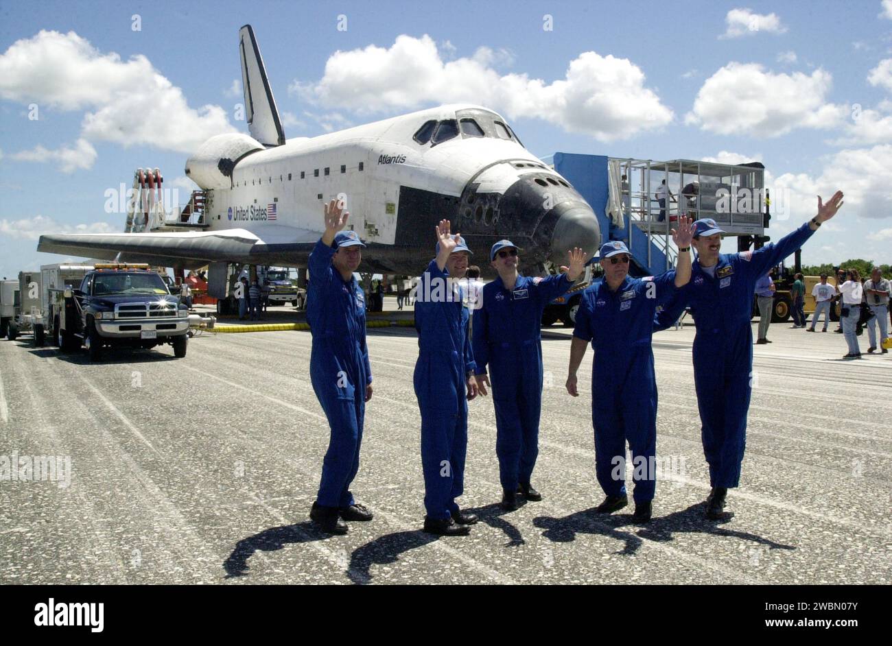 KENNEDY SPACE CENTER, FLA. - The STS-110 crew waves to spectators before leaving the Shuttle ...