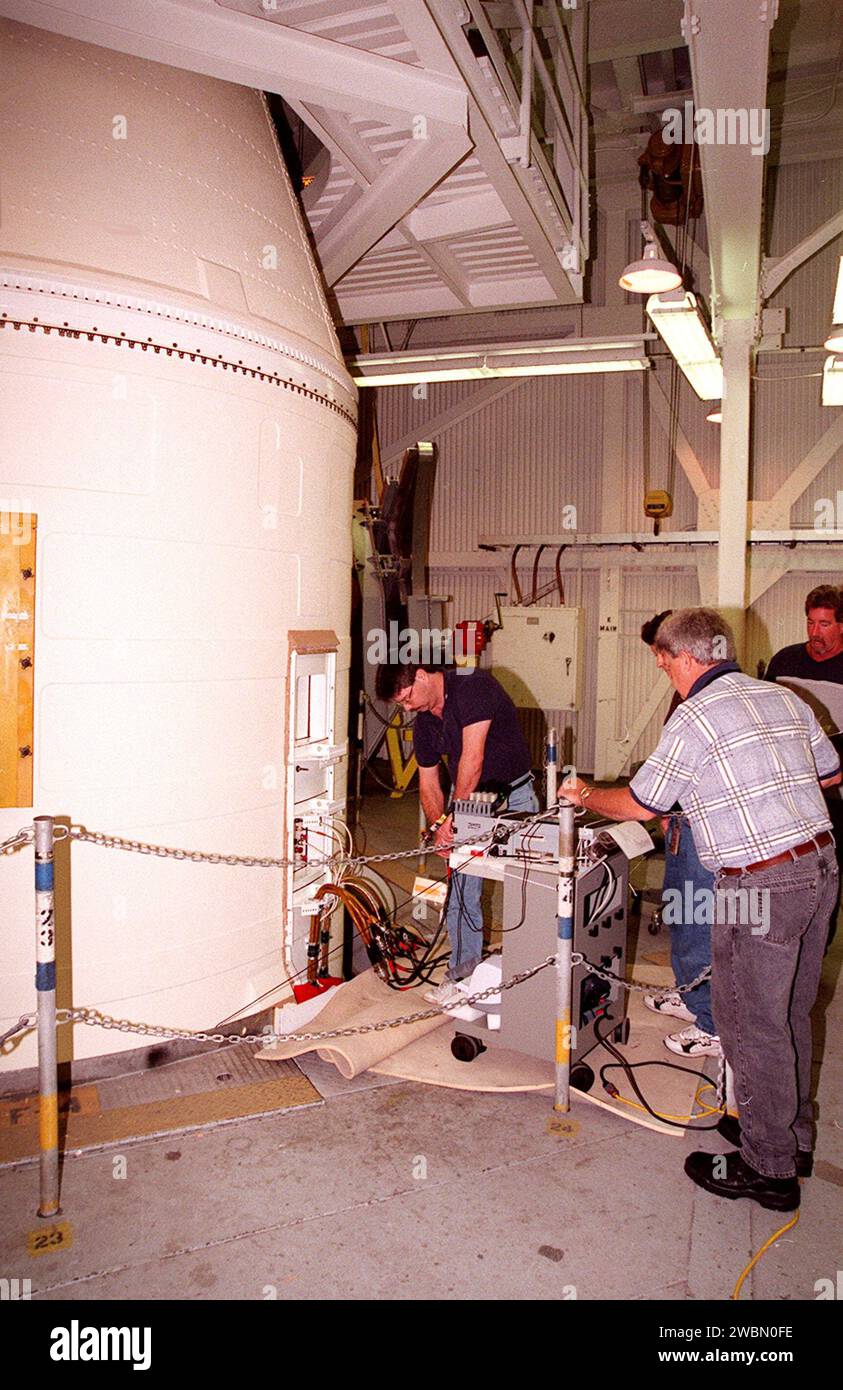 KENNEDY SPACE CENTER, FLA. -- Working near the top of a solid rocket ...