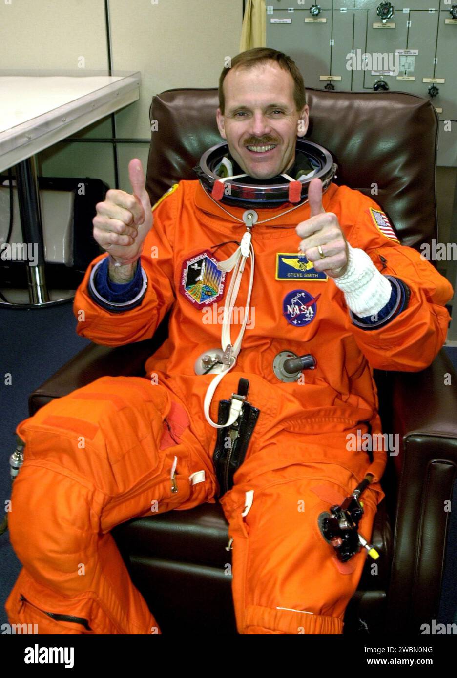 STS-110 Mission Specialist Steven L. Smith prepares for his fourth ...