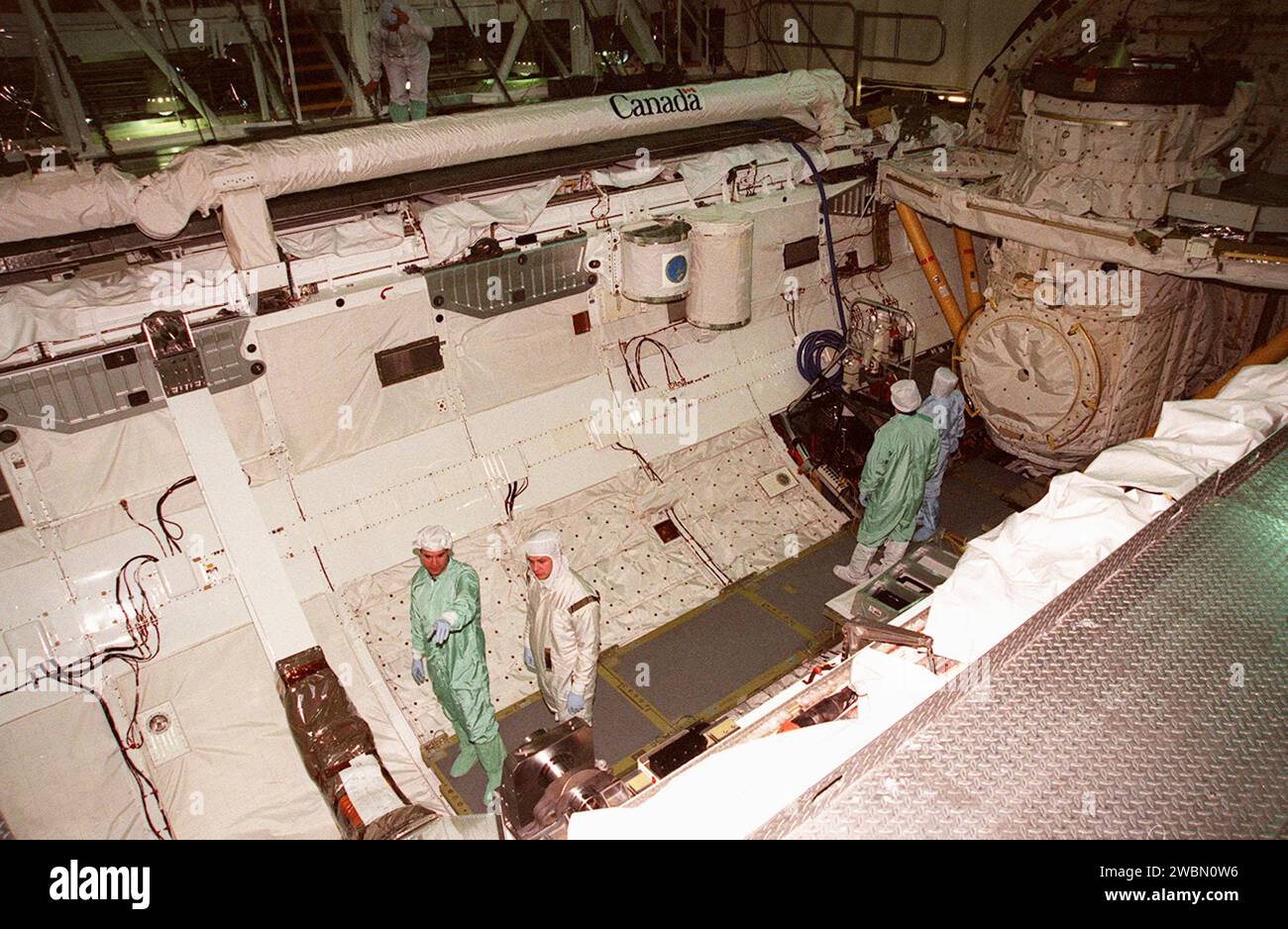 Members of the STS-102 crew check out Discovery’s payload bay in the ...