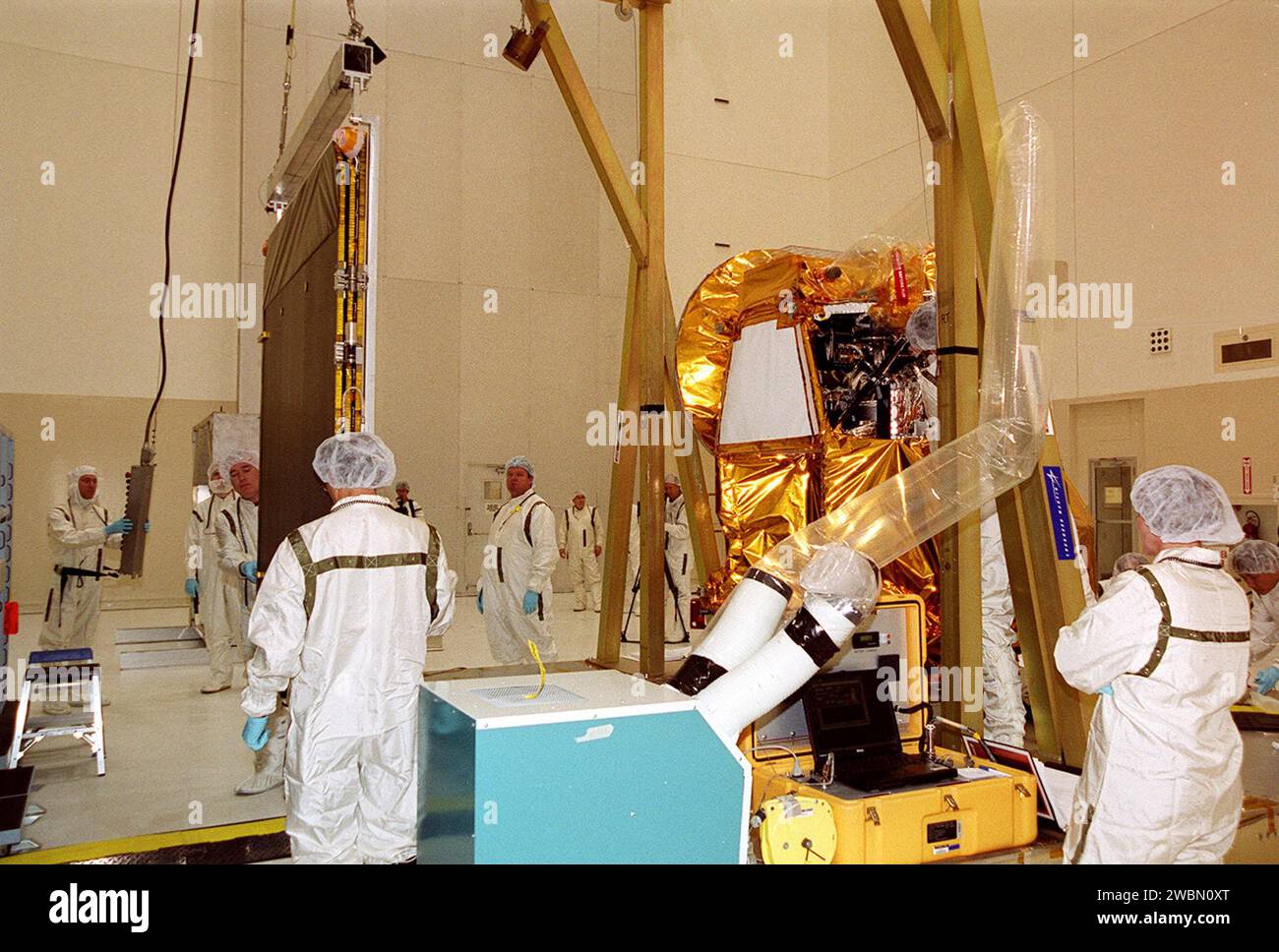 Workers in the Spacecraft Assembly and Encapsulation Facility -2 help ...