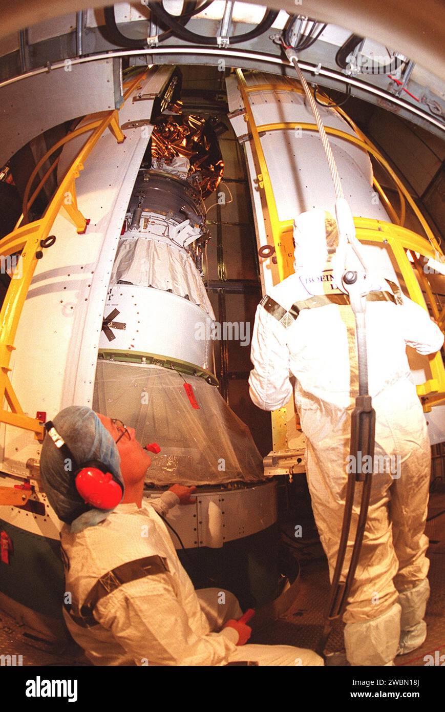 Workers at Launch Complex 17-A, Cape Canaveral Air Force Station, watch ...