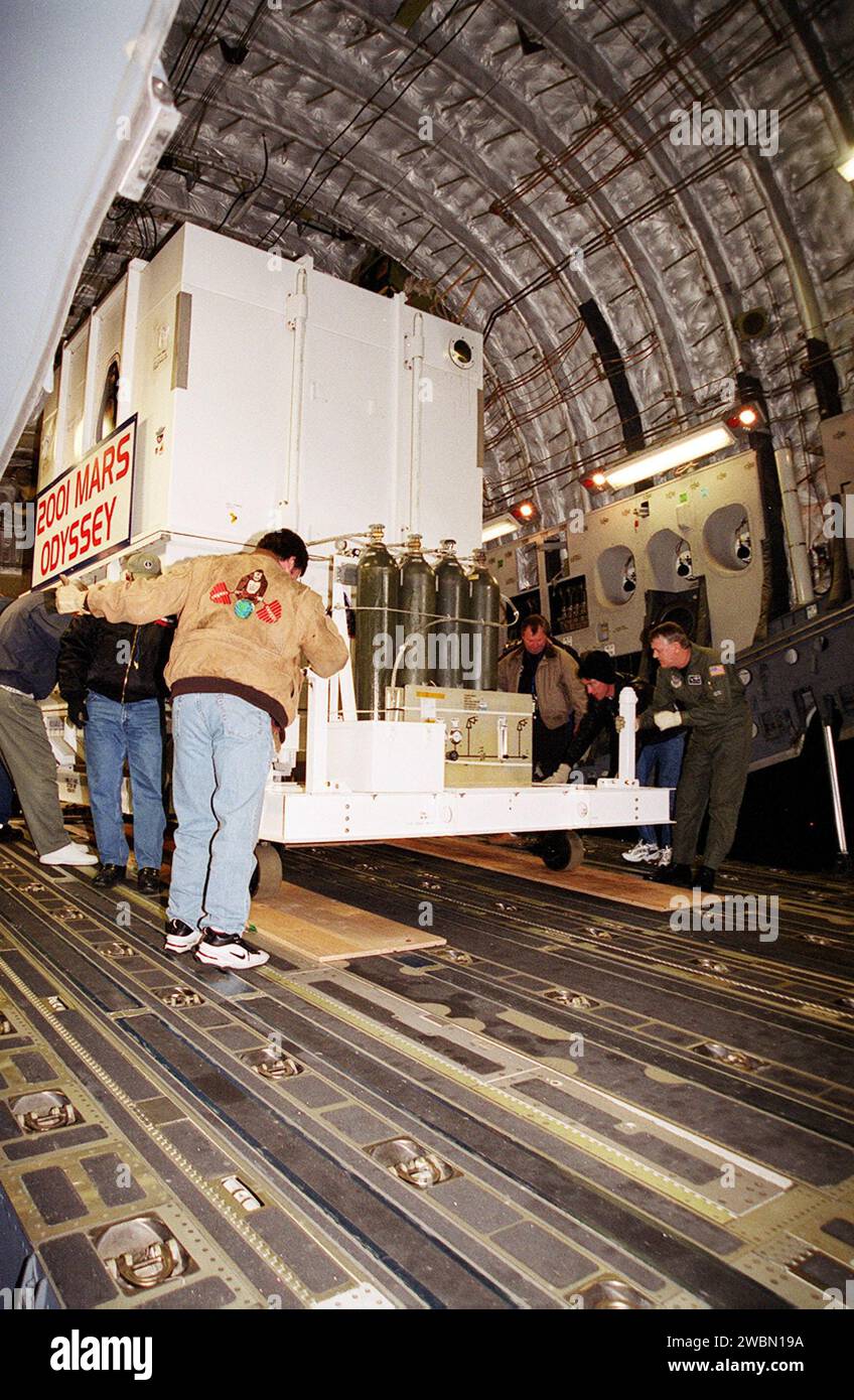 The Mars Odyssey spacecraft is maneuvered for removal from the Air ...