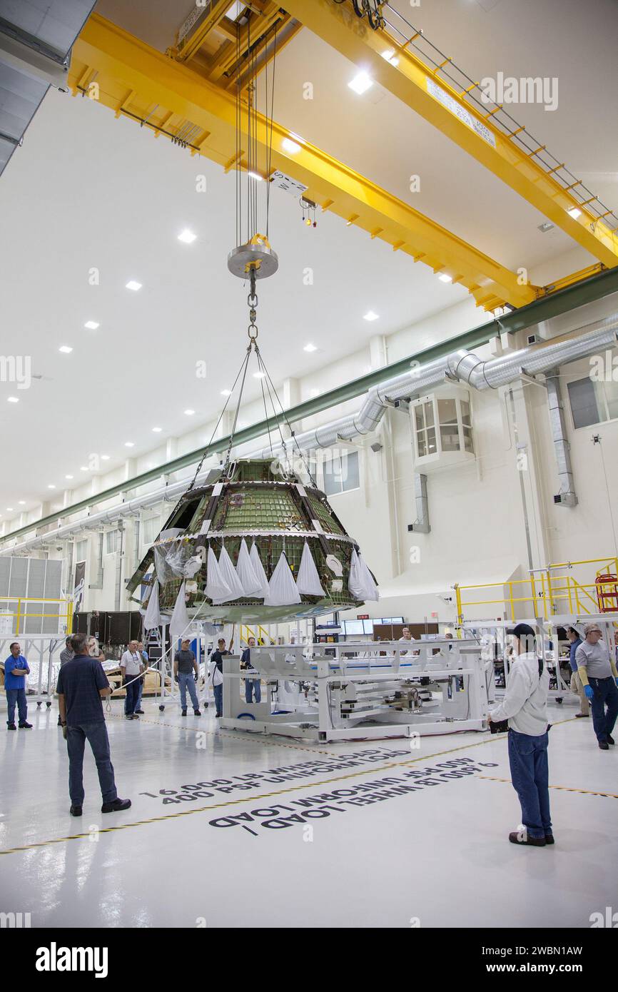 Technicians move the Exploration Flight Test-1 (EFT-1) Orion crew ... Technicians move the Exploration Flight Test-1 (EFT-1) Orion crew ...