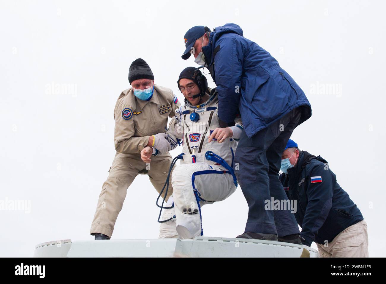 Expedition 63 Roscosmos cosmonaut Anatoly Ivanishin is helped out of ...