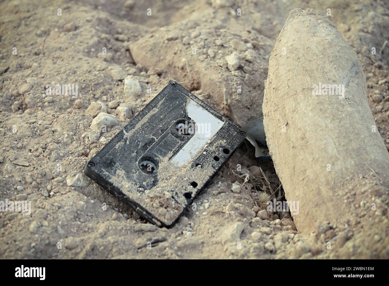 A damaged cassette audio tape on the ground Stock Photo - Alamy