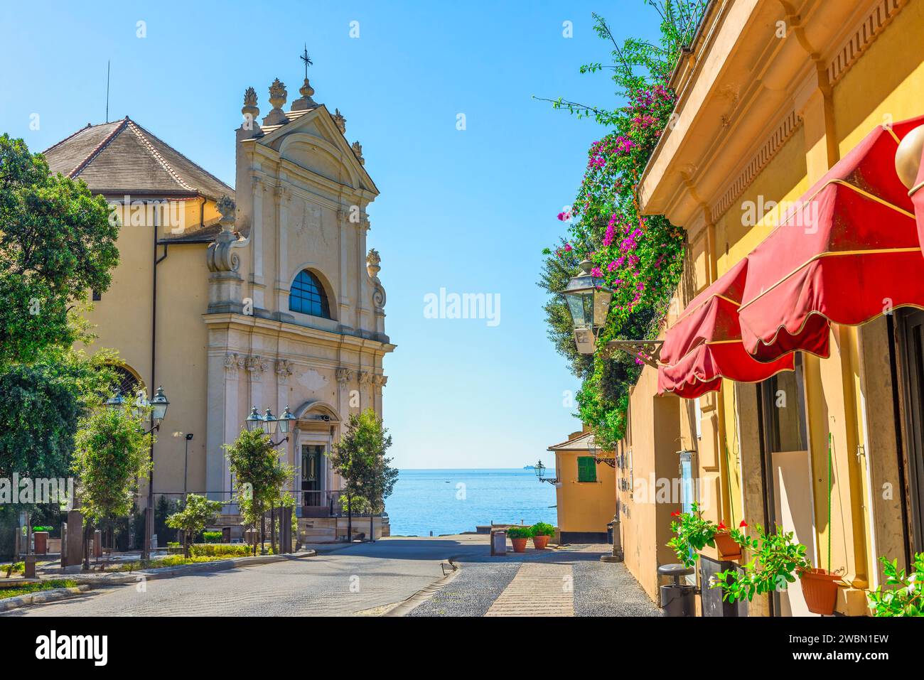 Street with beautiful colorful buildings in Varenna, Italy Stock Photo ...