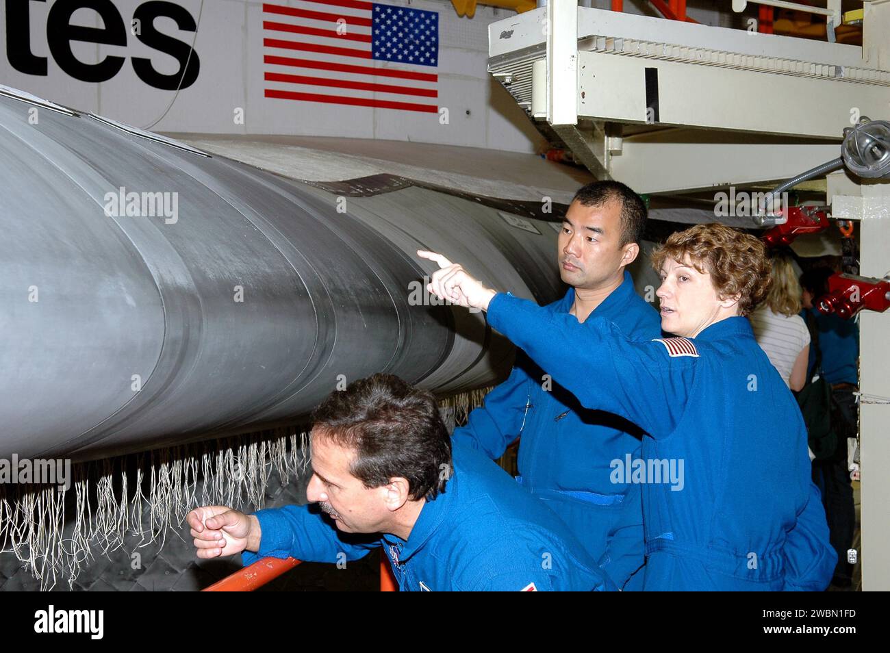 STS-114 crew members inspect the 22 Reinforced Carbon-Carbon panels on ...