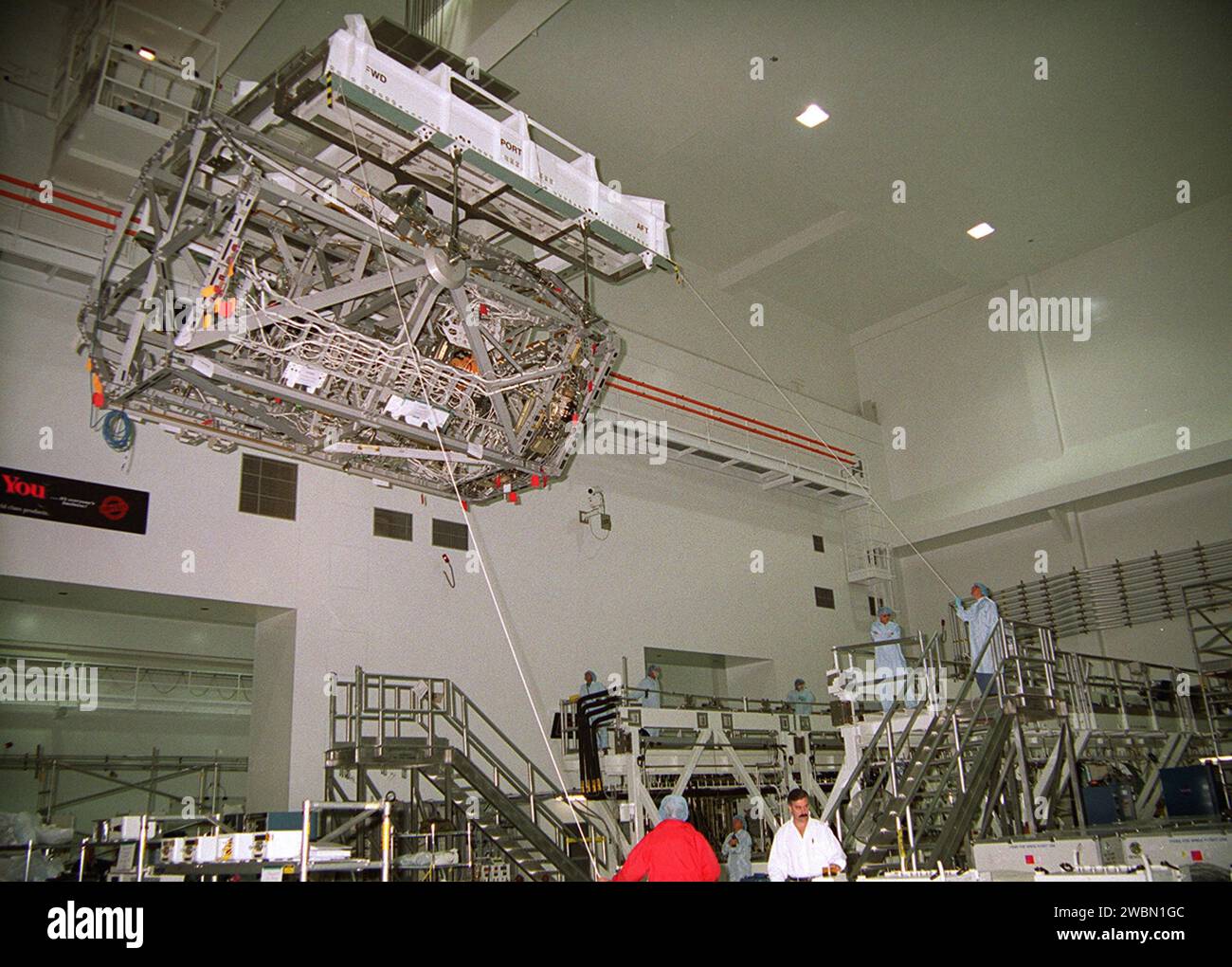 KENNEDY SPACE CENTER, FLA. -- Suspended from an overhead crane in the ...