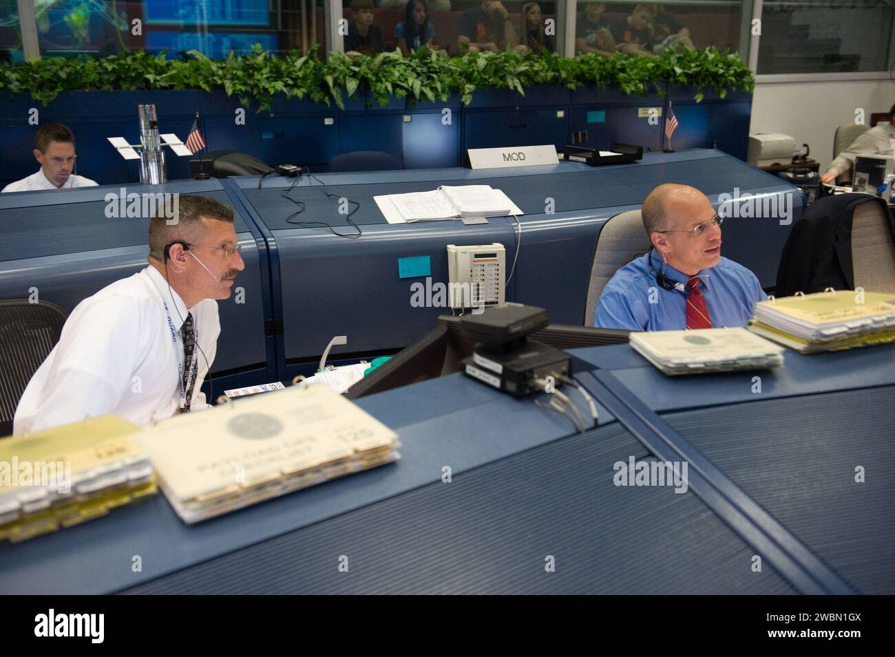Flight controllers led by Flight Director Tony Ceccacci monitor the ...