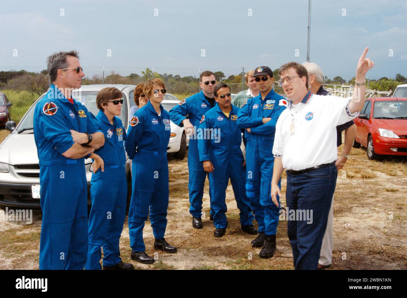 STS-114 crew learn about the installation and testing of a 30-foot C ...
