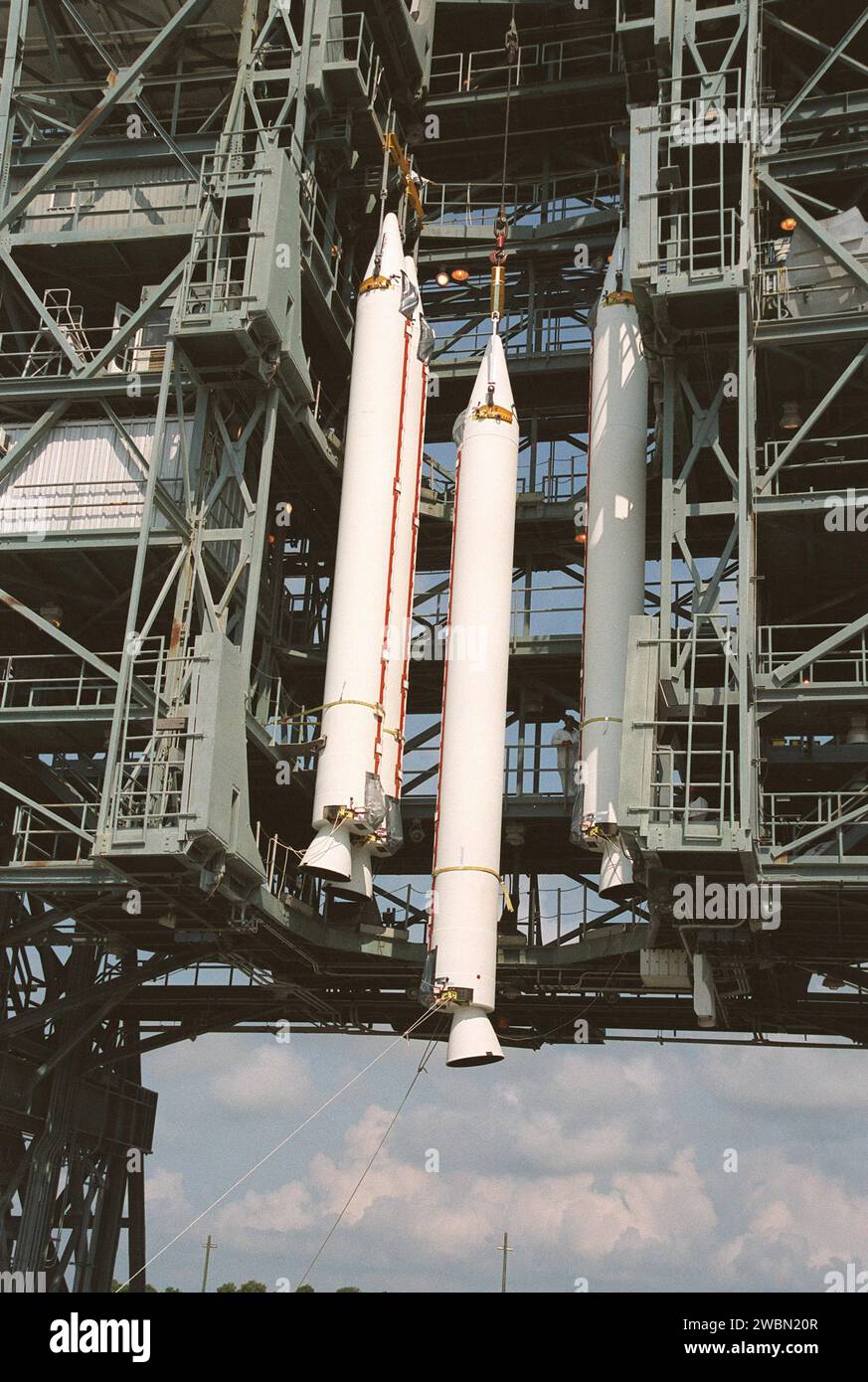 KENNEDY SPACE CENTER, FLA. -- Four solid rocket boosters are lifted up ...