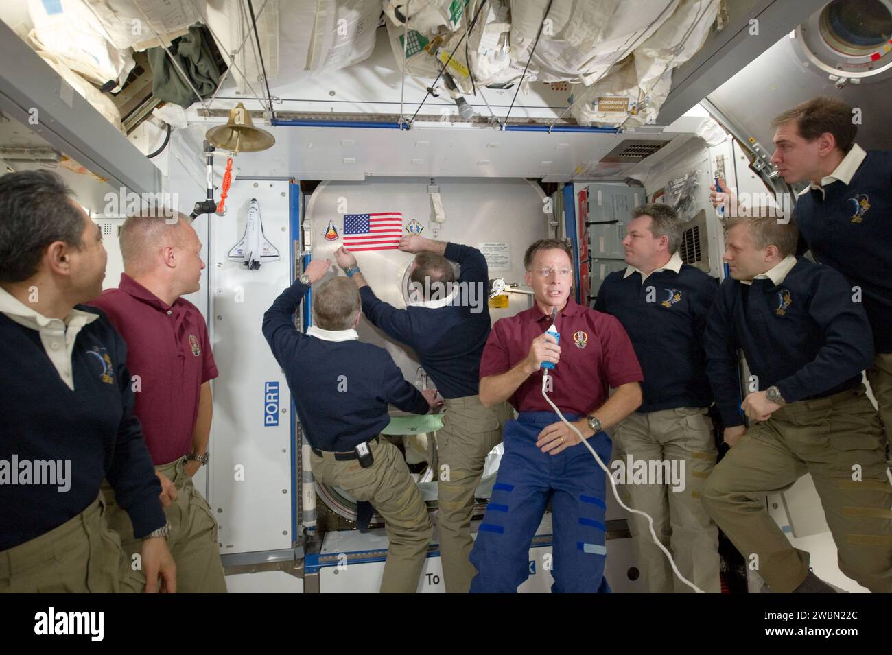 STS-135 commander Chris Ferguson presented a U.S. flag and a space ...