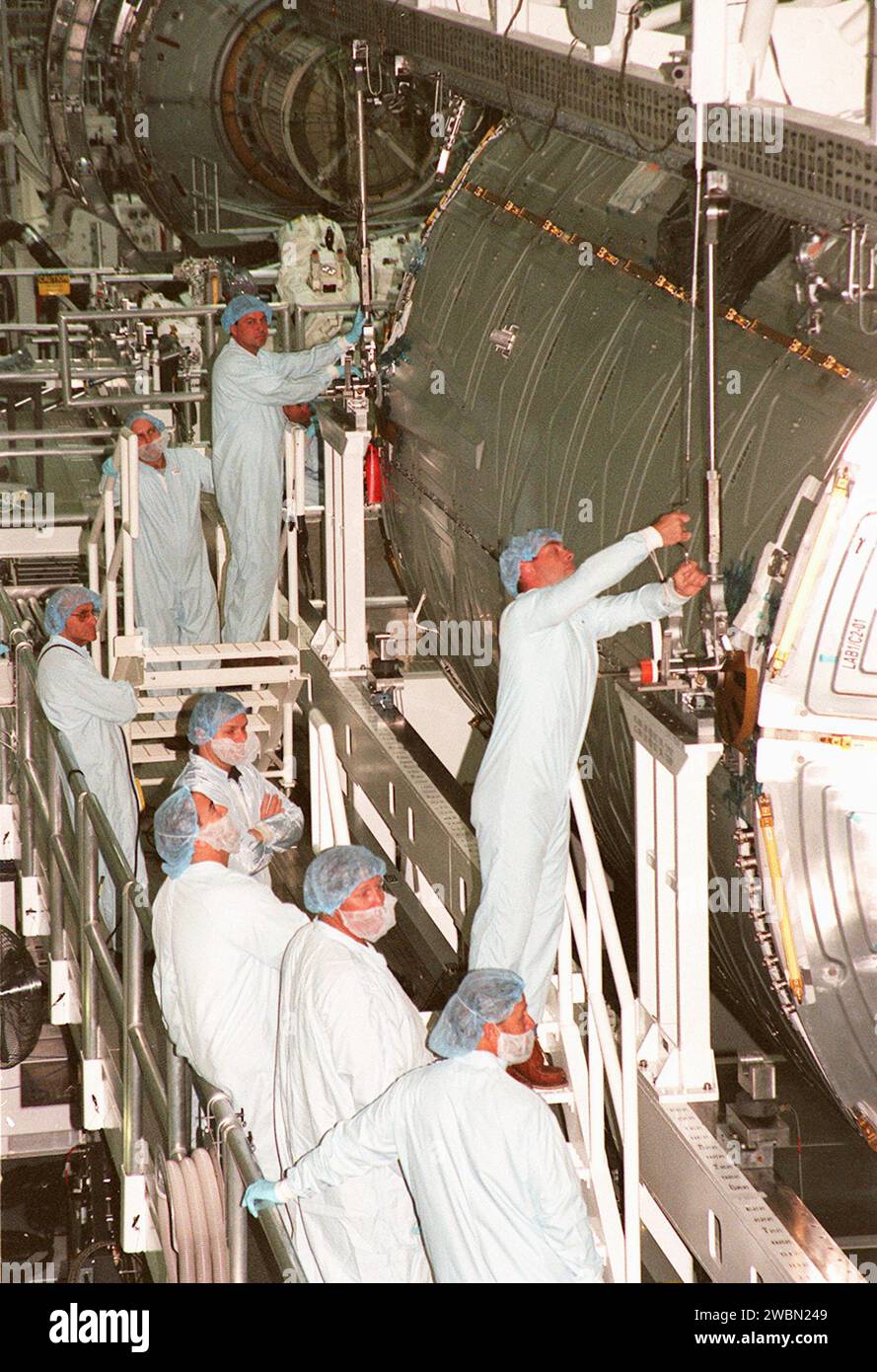 KENNEDY SPACE CENTER, FLA. -- Workers in the Space Station Processing ...