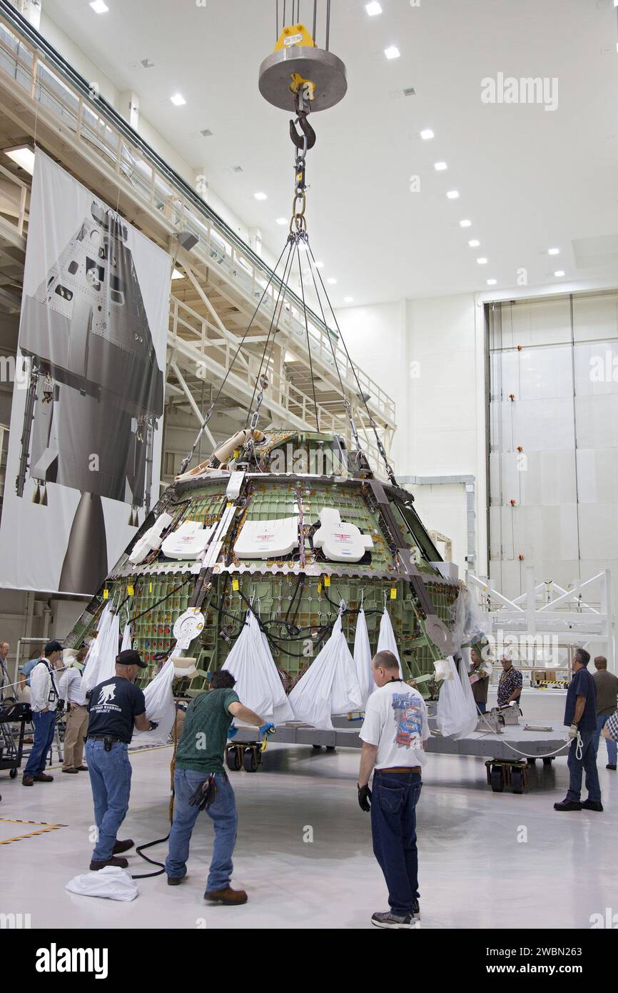 Technicians move the Exploration Flight Test-1 (EFT-1) Orion crew ... Technicians move the Exploration Flight Test-1 (EFT-1) Orion crew ...
