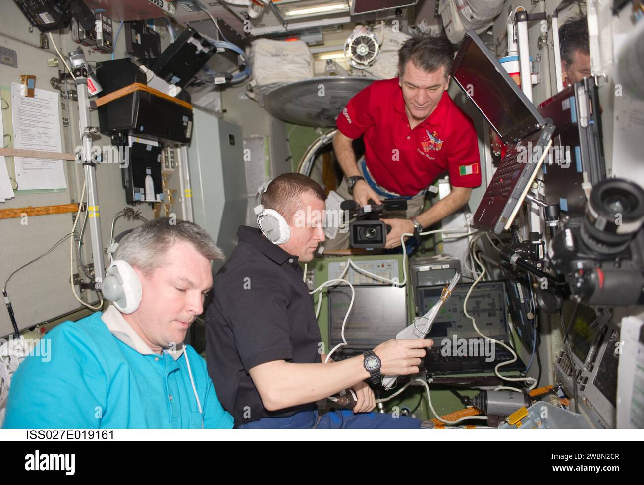 Cosmonauts Dmitry Kondratyev and Alexander Samokutyaev, with astronaut ...