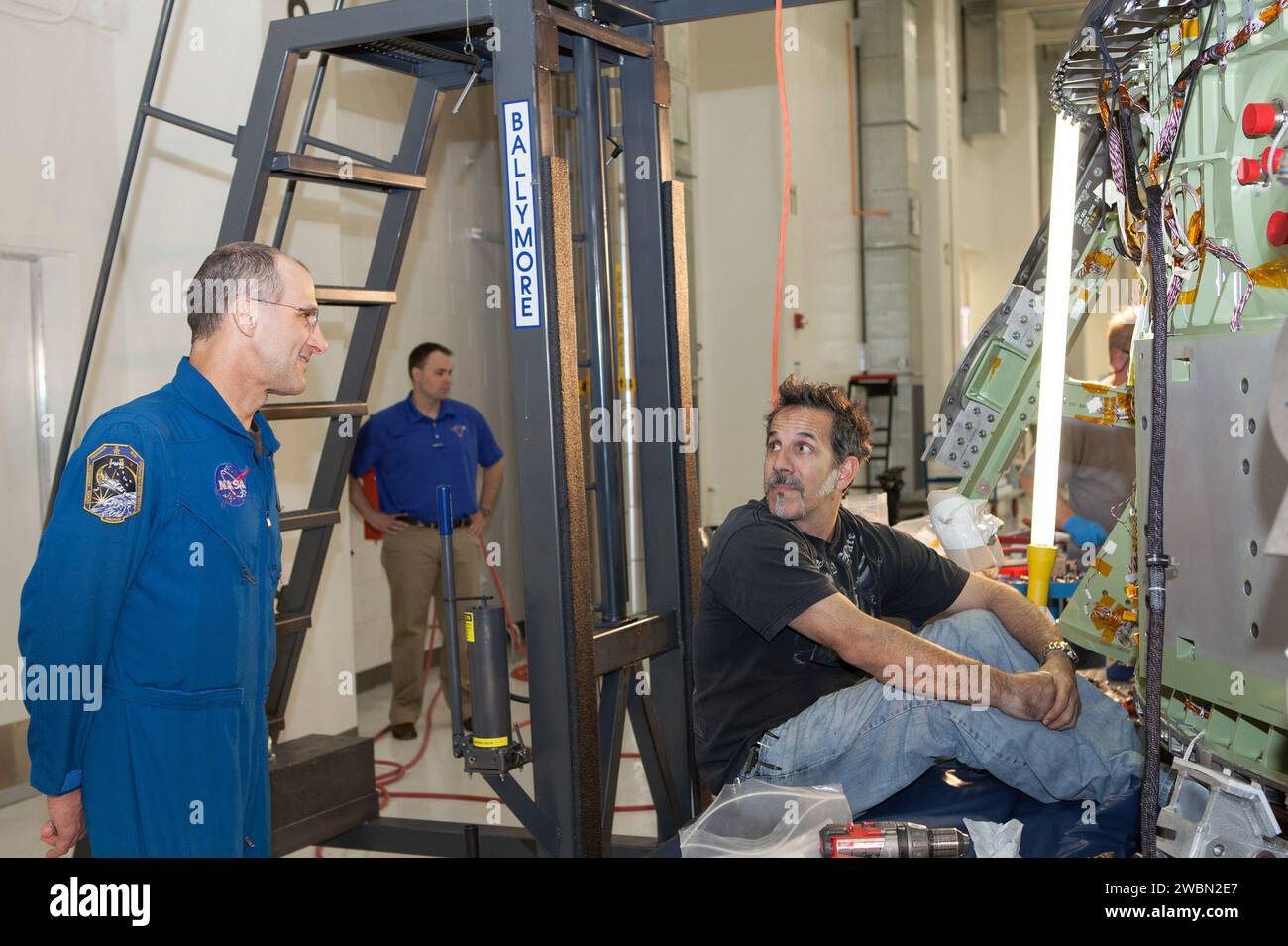 Technicians continue work on the EFT-1 Orion crew module inside the ...