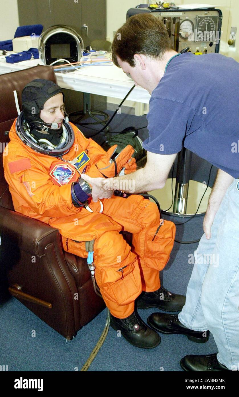 Expedition 4 astronaut Daniel Bursch undergoes a launch and entry suit ...