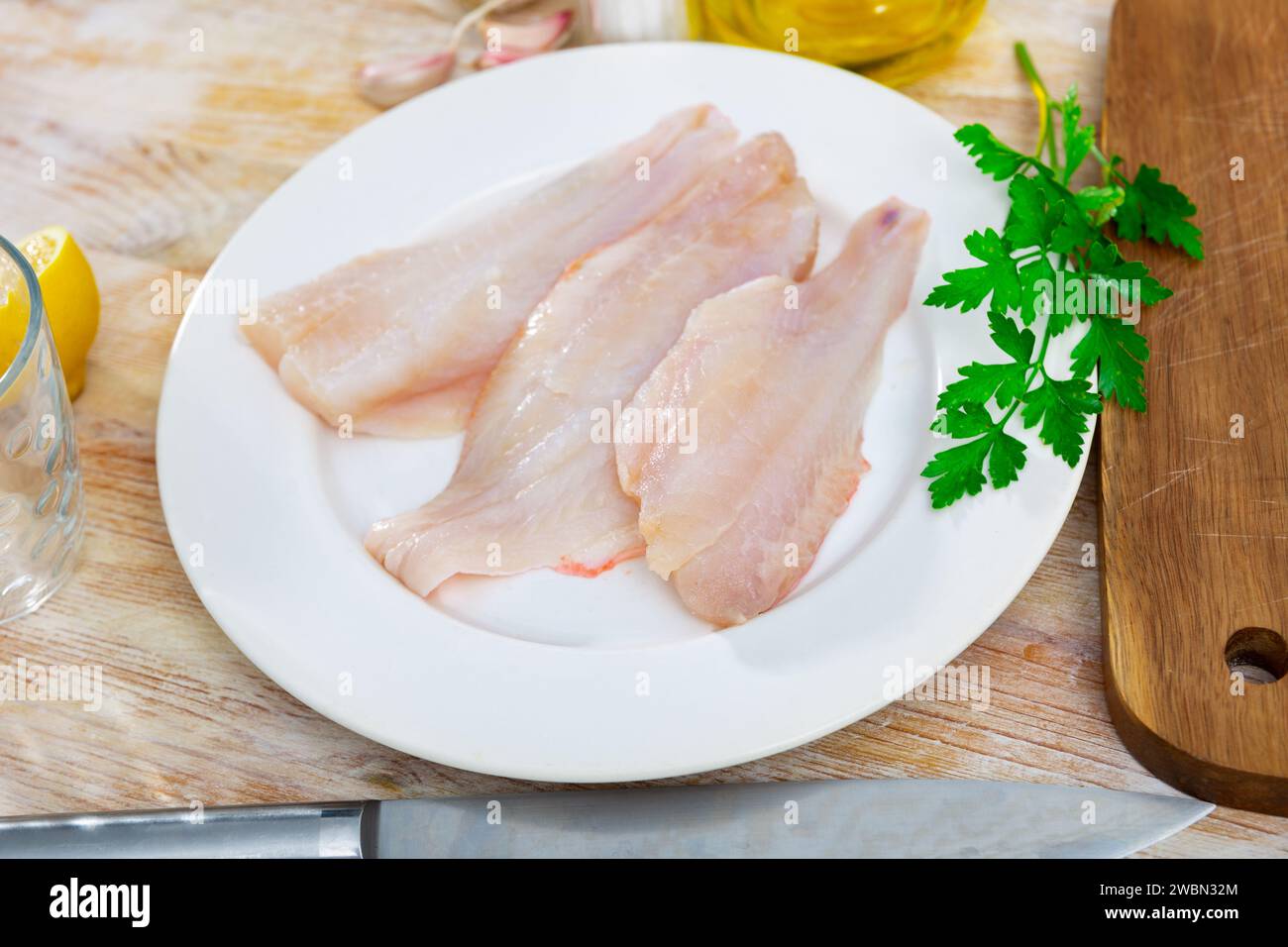 Raw rockfish fillet with condiments, cooking ingredients Stock Photo ...