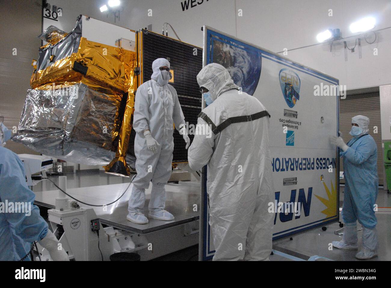 In a clean room inside the Astrotech Payload Processing Facility at ...