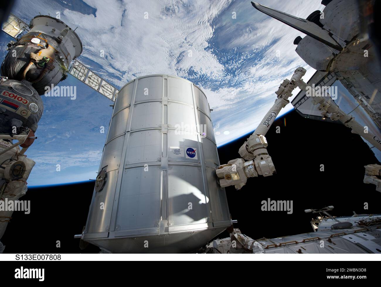 S133-E-007808 (1 March 2011) --- In the grasp of the International ...