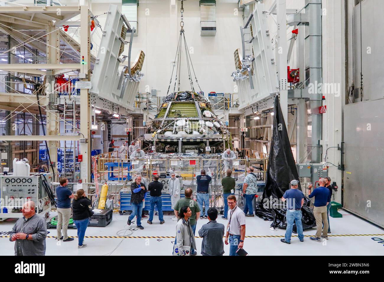 Engineers connect the Orion crew and service modules for the Artemis II ...