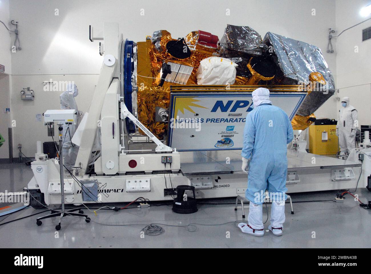 In a clean room inside the Astrotech Payload Processing Facility at ...