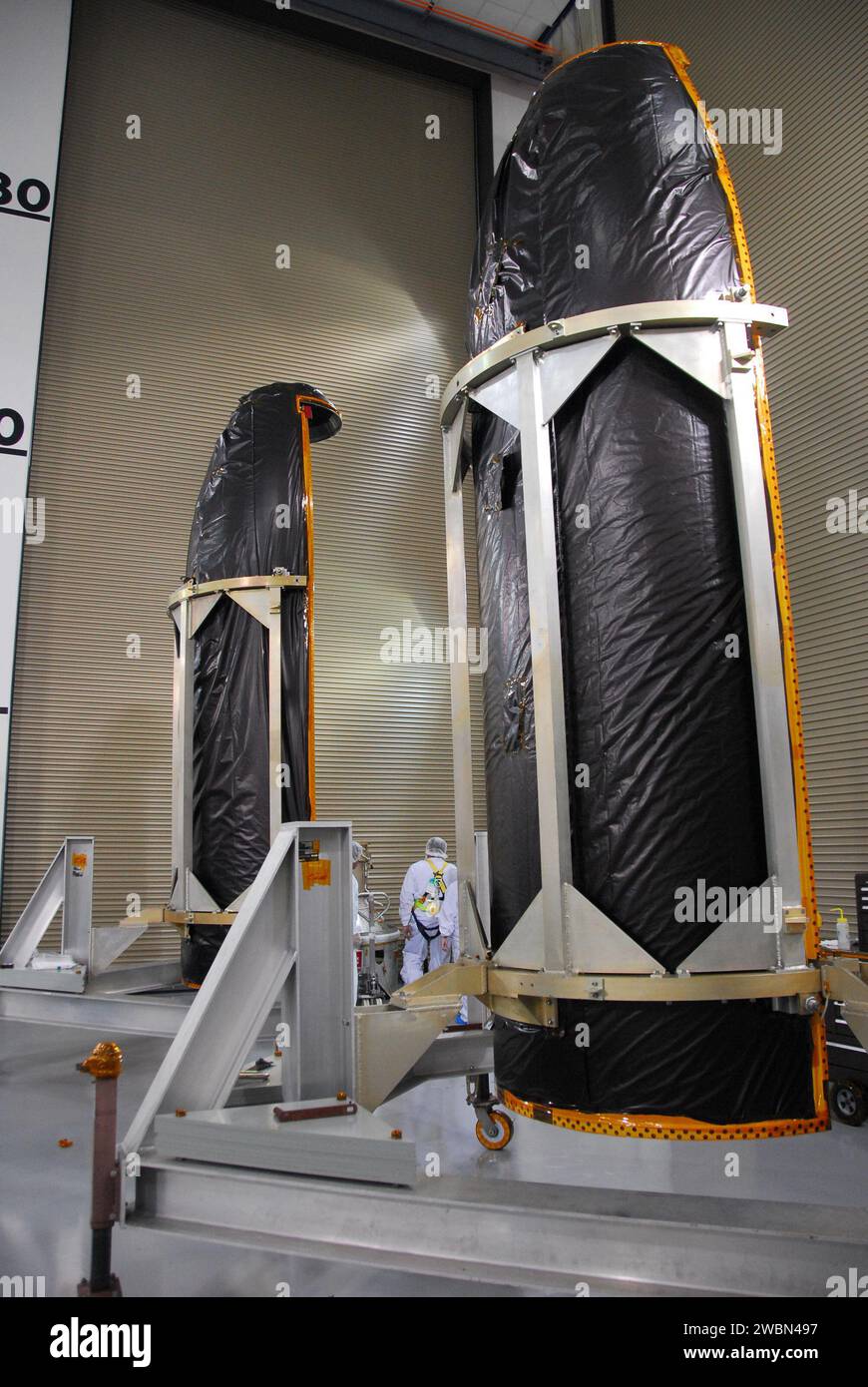 The two sections of the Glory mission payload fairing are staged in the ...