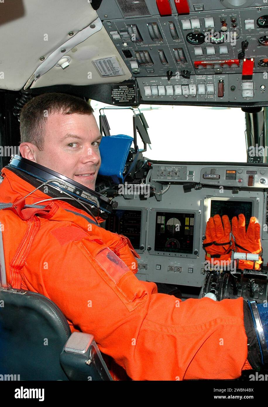 KENNEDY SPACE CENTER, FLA. - STS-114 Pilot James Kelly settles into the ...