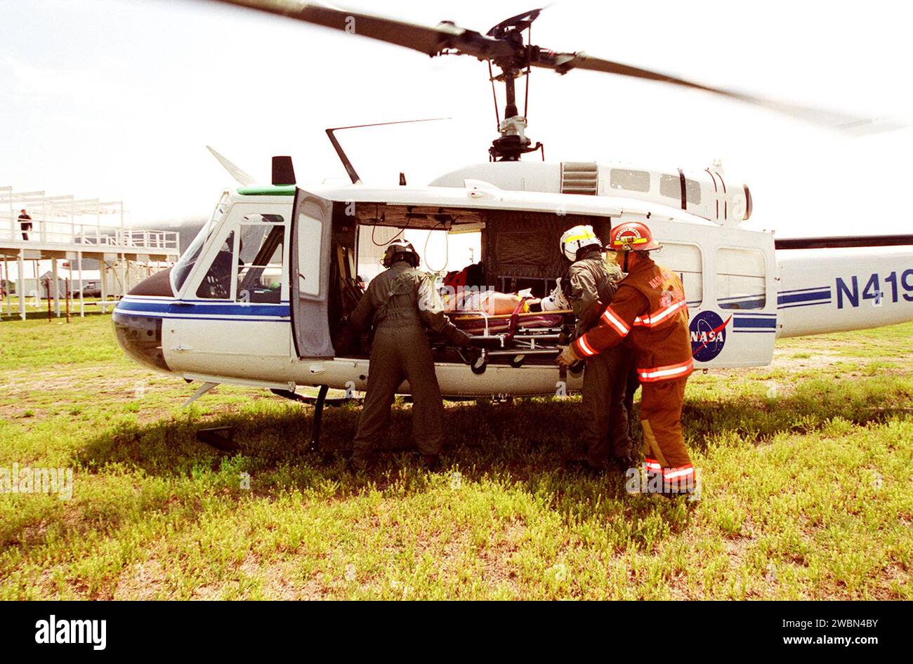 KENNEDY SPACE CENTER, FLA. -- Rescue personnel place a “victim” in a ...