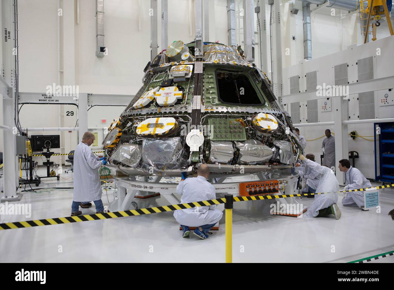 The Orion Exploration Flight Test-1 (EFT-1) crew module is prepared for ...