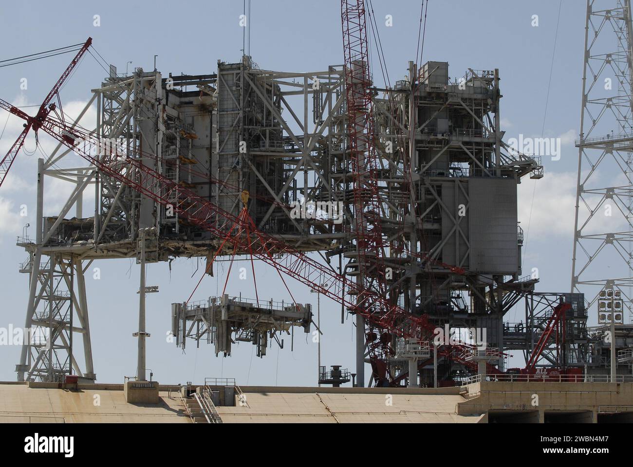 Cape Canaveral, Fla. -- A large crane dismantles another section of the ...