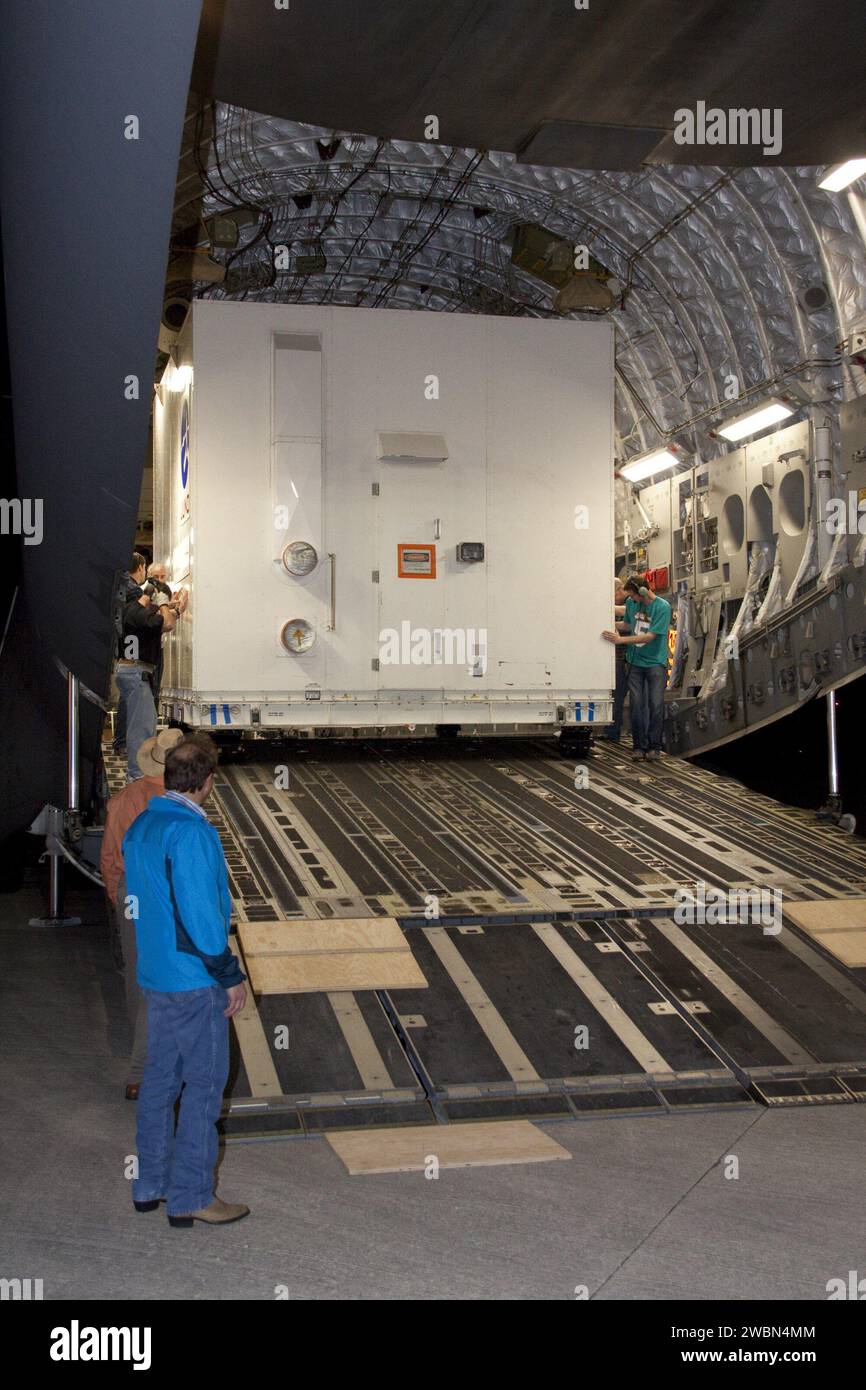CAPE CANAVERAL, Fla. -- Workers guide the container holding NASA's Juno ...