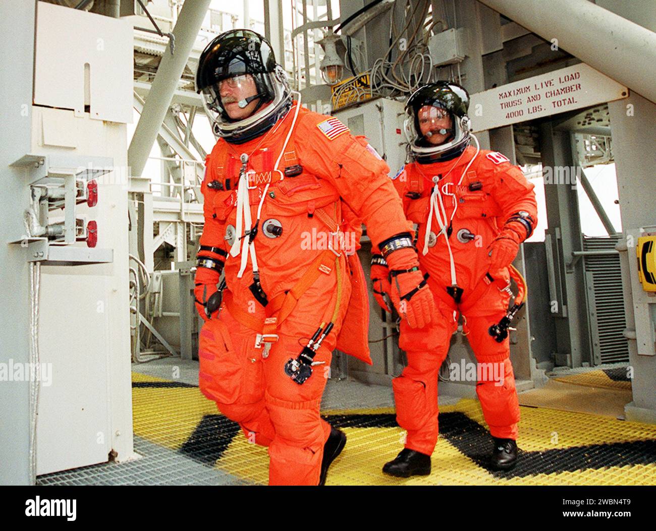 STS-100 Mission Specialists Phillips and Hadfield perform slidewire ...