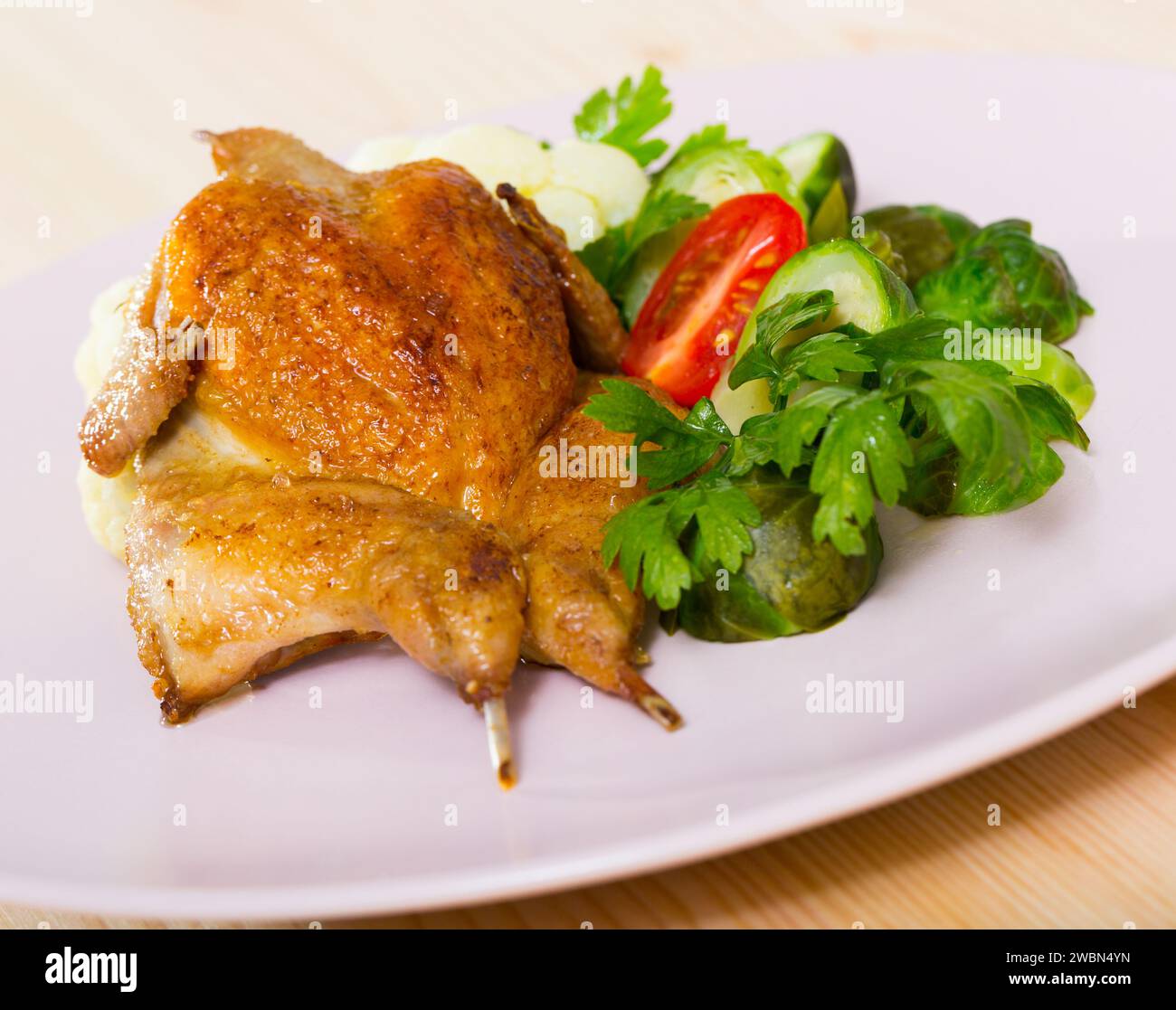 Grilled partridge with steamed vegetables Stock Photo - Alamy