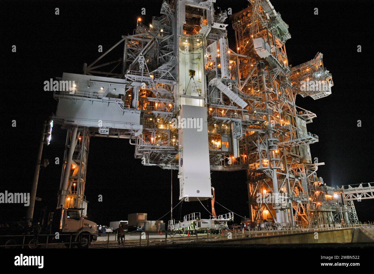 At Launch Pad 39B, the payload canister for STS-114 is lowered from the ...