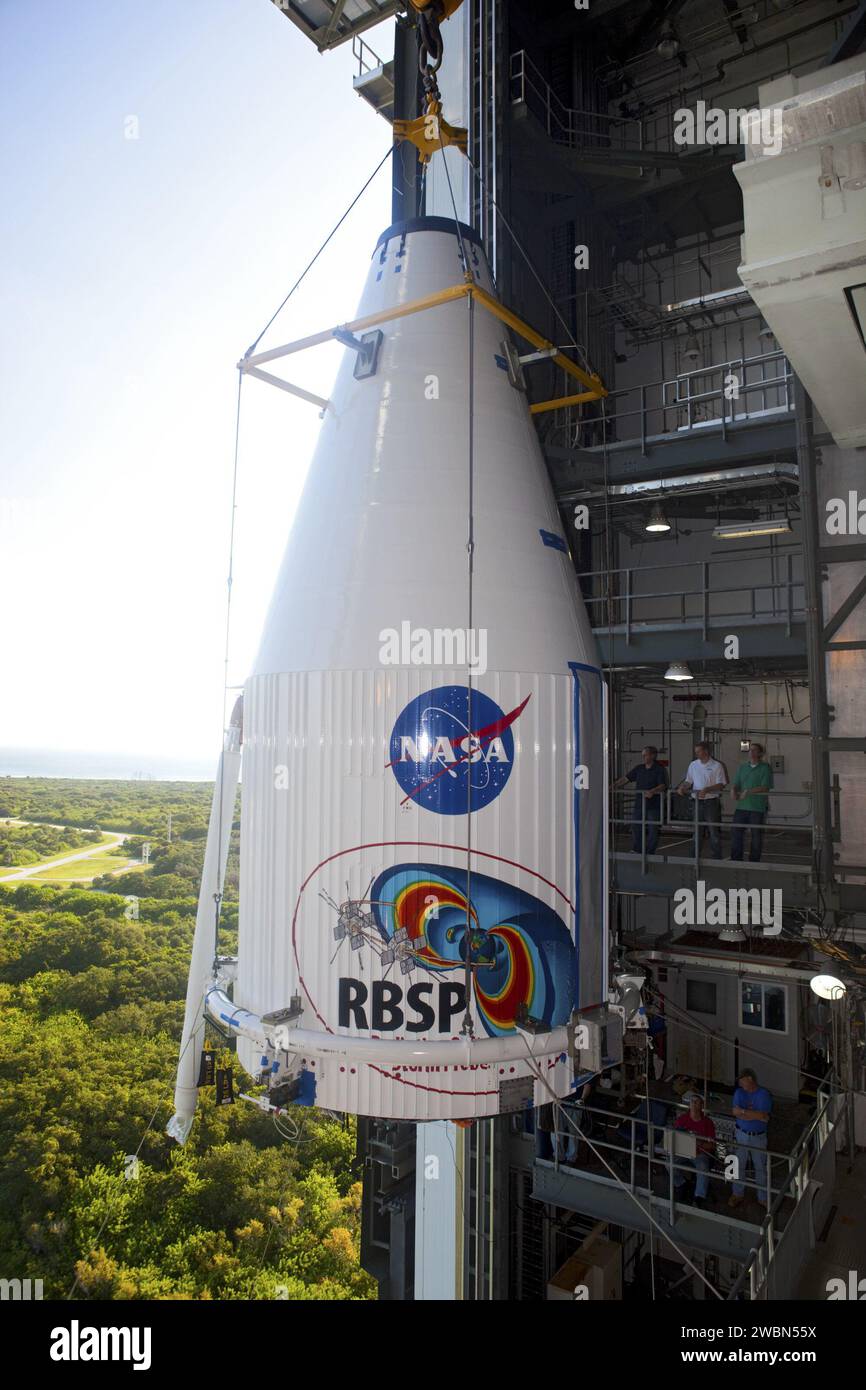 Technicians hoist the Radiation Belt Storm Probes (RBSP) spacecraft ...