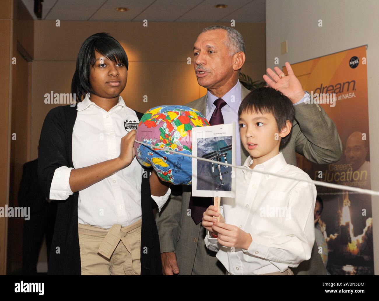 NASA Administrator Charles F. Bolden, center, stands with two ...