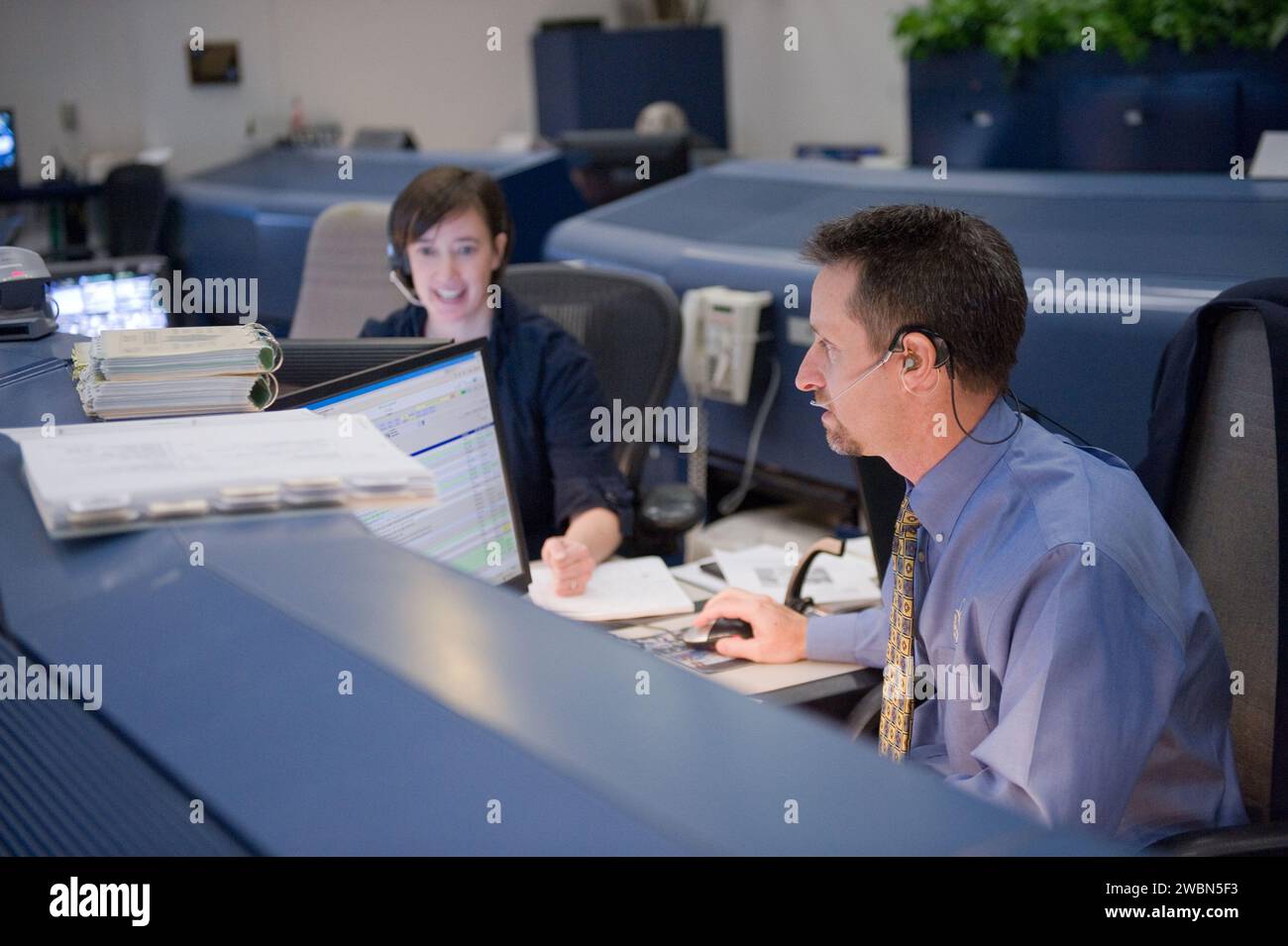 STS-134 Orbit 1 flight controllers on console during AMS install with ...