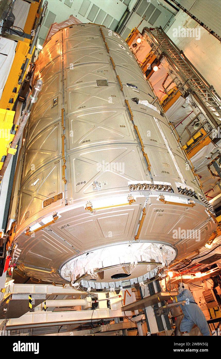 The U.S. Lab Destiny moves out of Atlantis’ payload bay and into the Payload Changeout Room via ...