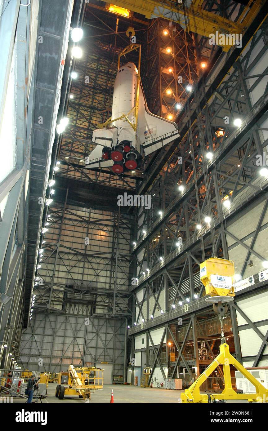 Space Shuttle Atlantis is lowered in the Vehicle Assembly Building ...